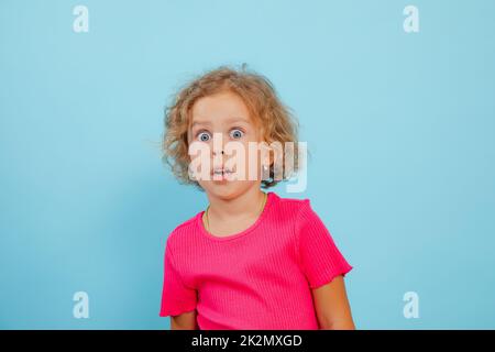 Portrait of little impressed kid open mouth speechless empty space ad ...