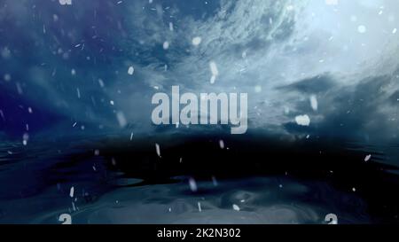 Snowing on Stormy Clouds Over Dark Ocean Stock Photo - Alamy