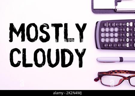 Hand writing sign Mostly Cloudy, Word Written on Shadowy Vaporous Foggy ...