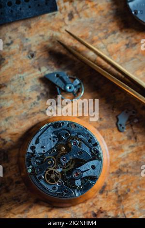 watchmaker workshop - top view of watch repairing tools on white ...