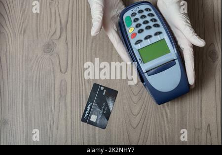 Sales assistant presenting a banking machine Stock Photo - Alamy
