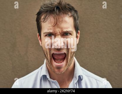 Hes about to bite someones head off. Portrait of an angry young man ...