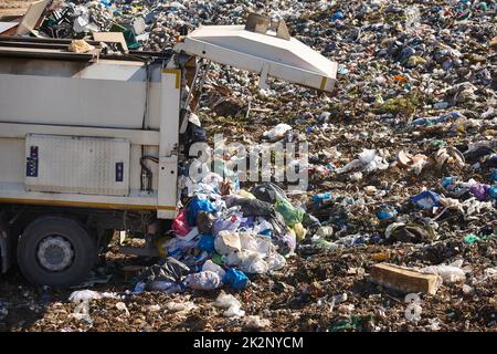 Truck unloading garbage on an open air dump. Waste recycling Stock ...