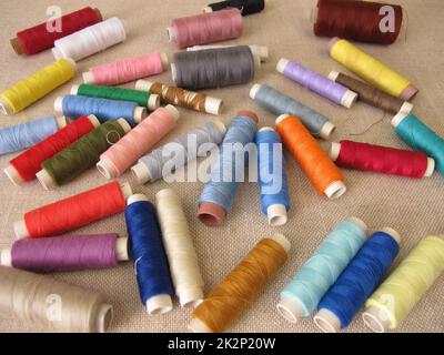 Sewing thread rolls in different colors Stock Photo - Alamy
