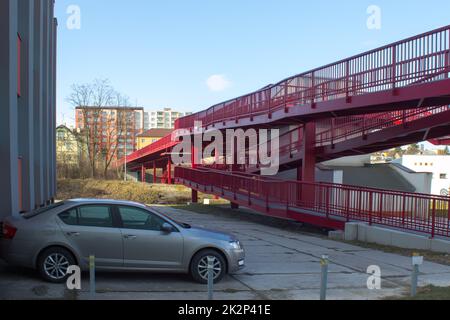 New red bridge over railway and block of flats Stock Photo - Alamy