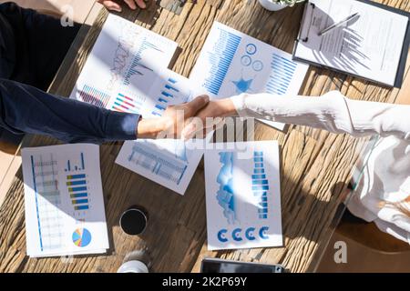 Financial Graph And Diagram. Analyst Shake Hands In Meeting Stock Photo ...