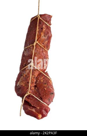hanging raw pork fillet Stock Photo - Alamy