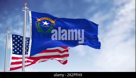 The Nevada state flag waving along with the national flag of the United ...