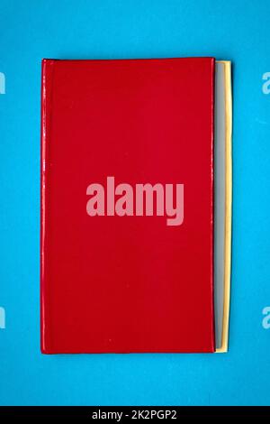 New red hardcover book with blank cover on white background Stock Photo ...