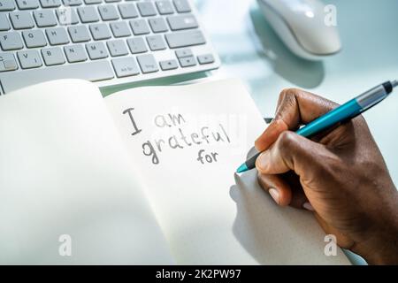 Gratitude Journal Concept. Writing I Am Grateful In Journal Stock Photo ...