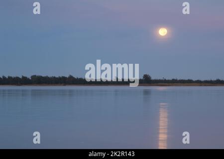 Full moon at sunset over the Senegal River Stock Photo - Alamy