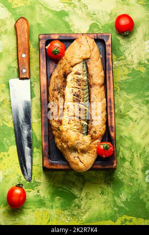 Mackerel baked in bread loaf Stock Photo - Alamy
