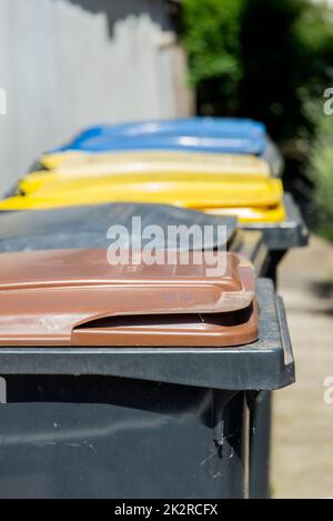 Garbage cans in closeup Stock Photo - Alamy