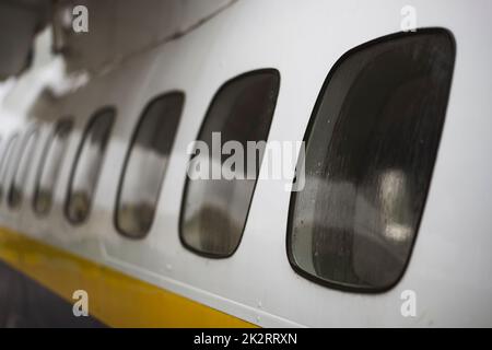 Close-up of the windows of an airplane outside Stock Photo - Alamy
