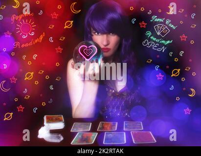 Psychic Tarot Card Reader With Neon Signs Stock Photo - Alamy
