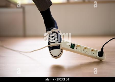 Wire Cord Trip Over And Fall. Feet Stumble On Cable Stock Photo - Alamy