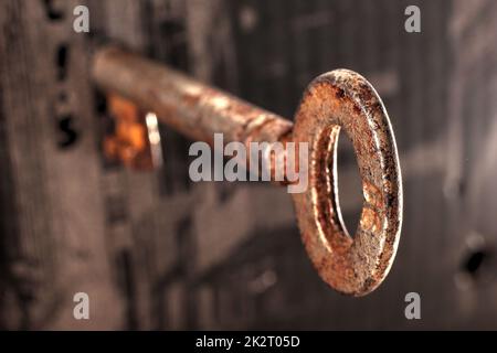 Old rusty keys inside a keyhole of an old antique closet. vintage ...