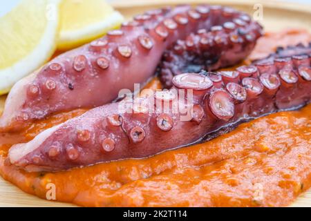 Roasted octopus tentacles with chilli romesco sauce Stock Photo - Alamy
