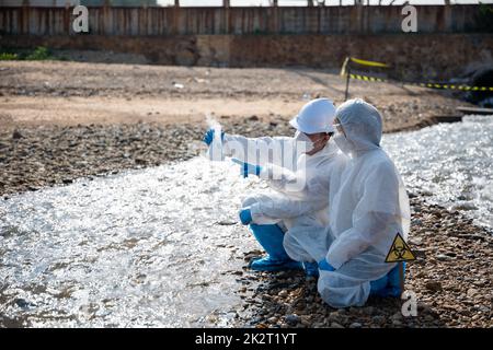 Ecologist sampling water from the river with test tube Stock Photo - Alamy