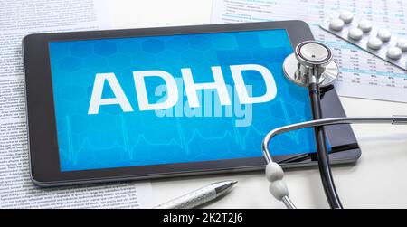 The word ADHD on the display of a tablet Stock Photo - Alamy