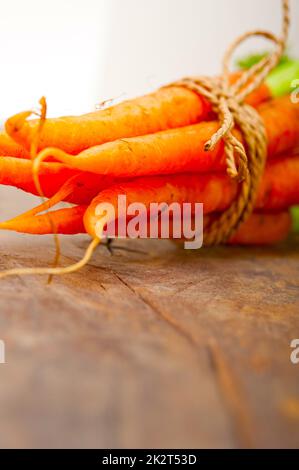 baby carrots bunch tied with rope Stock Photo - Alamy