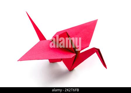 Red paper crane origami isolated on a white background Stock Photo - Alamy