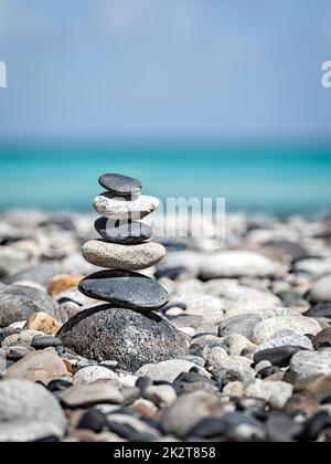 Close up of stones balanced and piled on top of each other on top of a ...