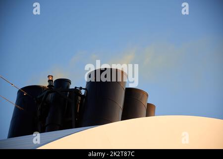 smoking chimney of an ordinary cruise ship Stock Photo - Alamy