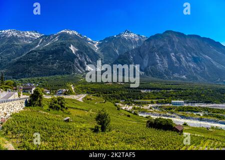 Vineyards and river in Swiss Alps mountains valley, Leuk, Visp, Wallis ...