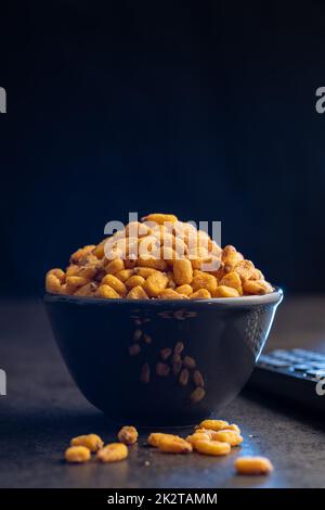 Roasted salted corn snack in bowl isolated on white background Stock ...