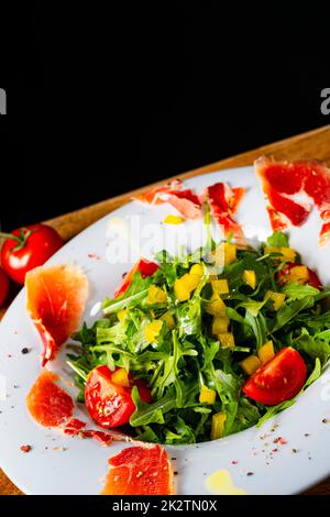 Rocket salad with dried Spanish ham Stock Photo - Alamy