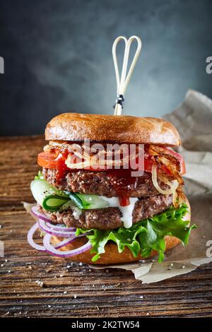 Double Meat Burger with fried onion rings, cheese and pickled jalapeños ...
