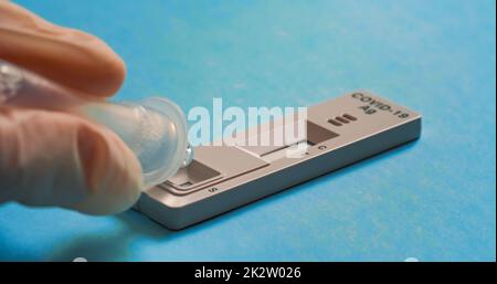 Adding drops to the details of the Covid-19 Antigen Test Stock Photo ...
