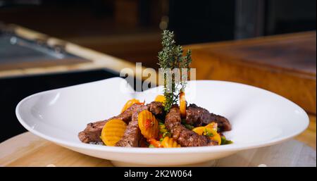Beef Meal Presentation on White Plate Close Up. Chef Specialty Dish ...