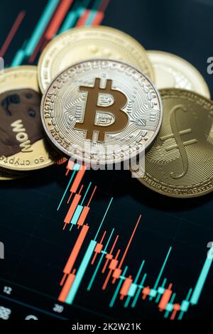Various Cryptocurrencies with candle stick graph chart and digital ...