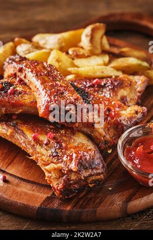 Tasty hot grilled bone pork steak served sauce Stock Photo - Alamy