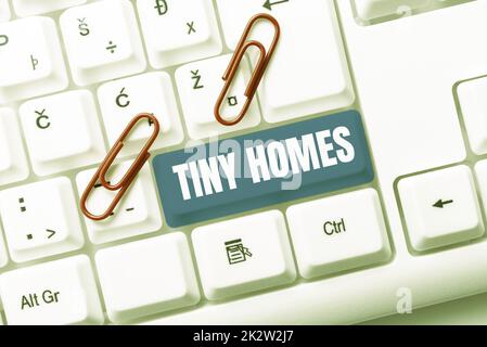 Text sign showing Tiny Homes. Word for houses contain one room only or ...