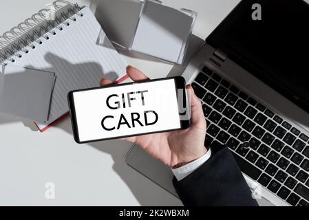 Hand writing sign Gift Card. Concept meaning A present usually made of ...