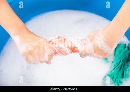 Female squeeze wring out wet fabric cloth Stock Photo - Alamy