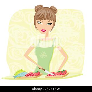 Beautiful lady cooking in the kitchen Stock Photo - Alamy