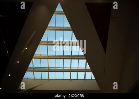 Architectural glass structure with a geometric triangular pattern on a ...