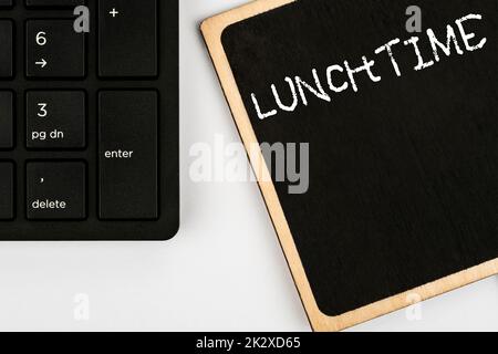 Hand writing sign Lunchtime. Conceptual photo Meal in the middle of the ...