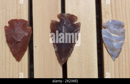 Native American Arrowhead Collection on Wooden Background Stock Photo ...