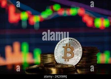 Gold Bitcoins with candle stick graph chart and digital background ...