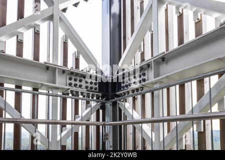 Massive industrial steel construction end-to-end with bolts and nuts on ...