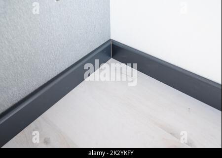 The plinth is dark gray to match the color of the door, mounting the ...
