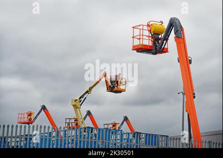 Access platform equipment powered high in sky at construction building ...