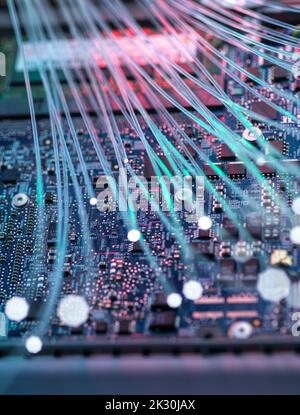 Fiber optic cables against computer mother board Stock Photo - Alamy