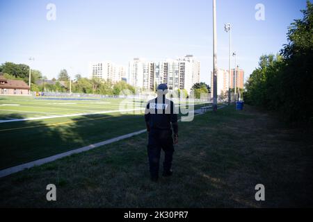 Security guard patrolling soccer stadium Stock Photo - Alamy