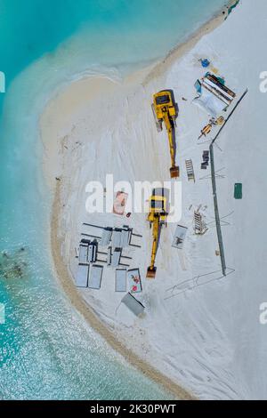 Maldives, Aerial view of construction site at edge of sandy beach Stock ...